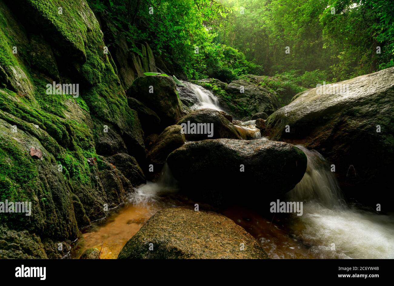 Beautiful waterfall in jungle. Waterfall in tropical forest with green ...