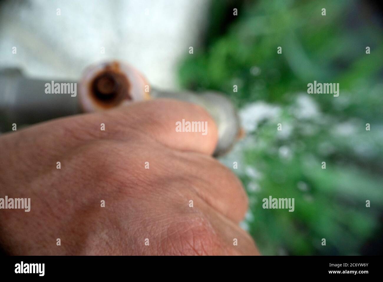 open outdoor water tap spreading macro detail Stock Photo - Alamy