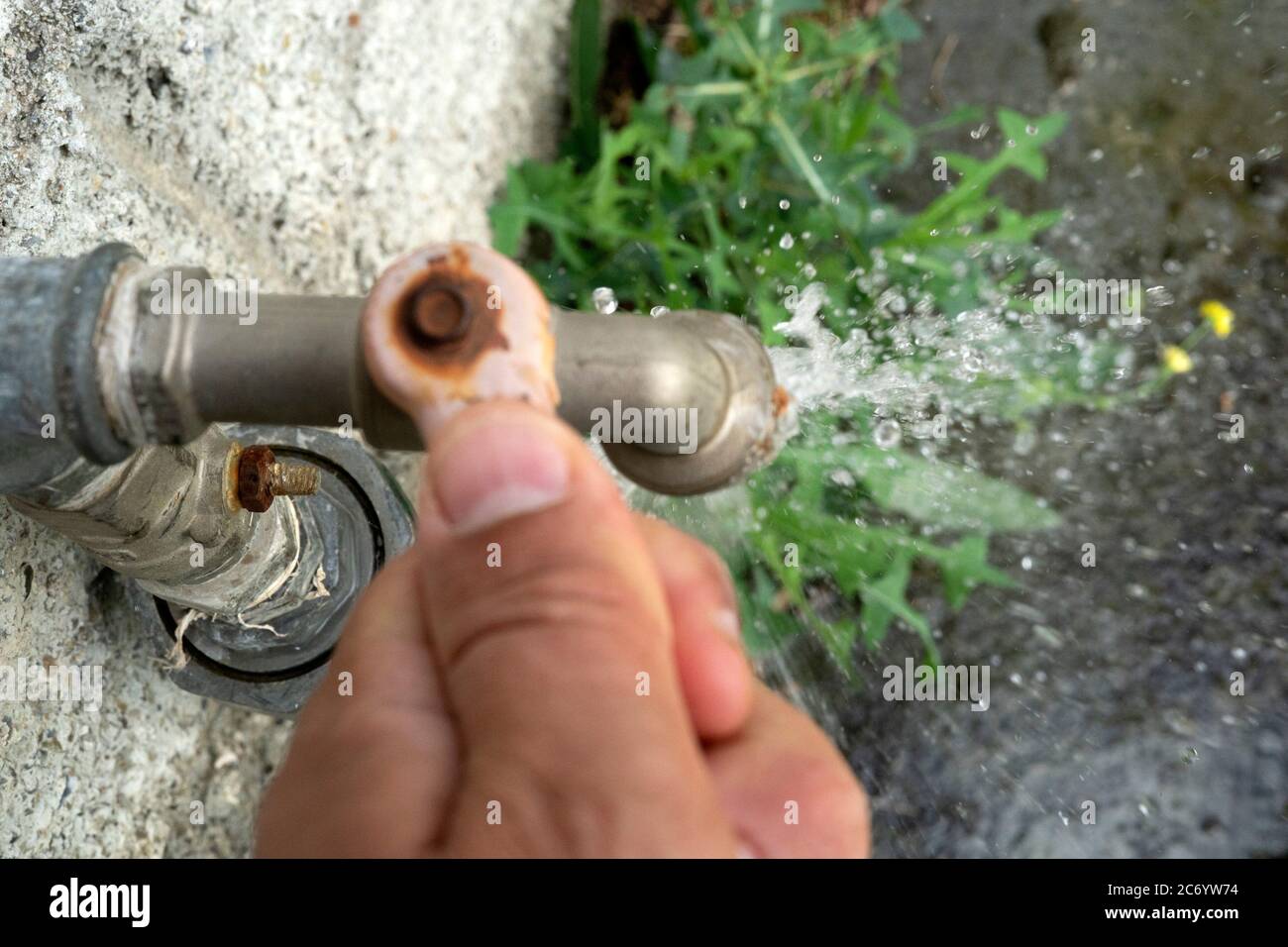 open outdoor water tap spreading macro detail Stock Photo - Alamy