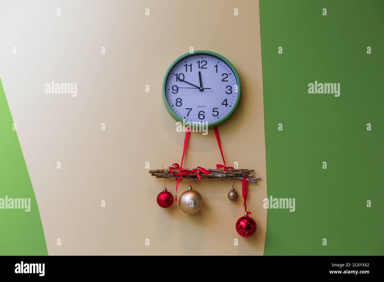 A clock hanging on the wall Stock Photo - Alamy
