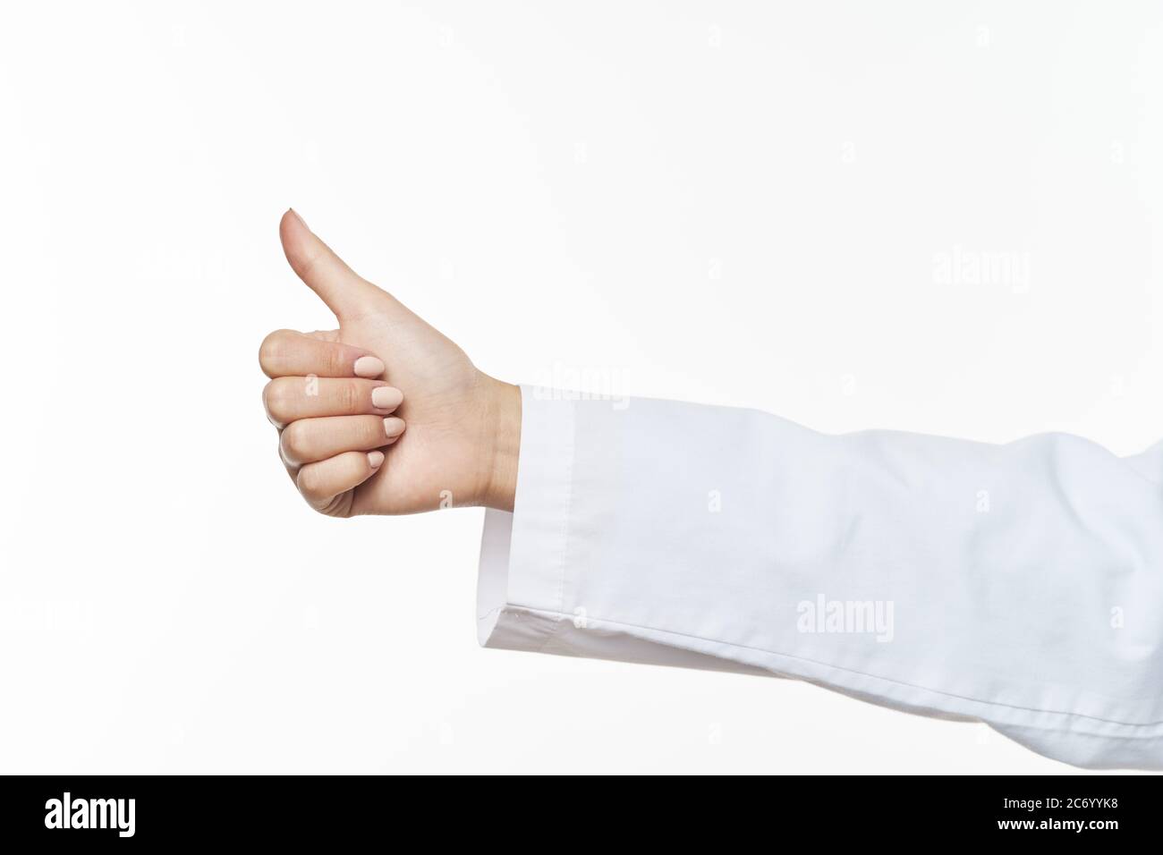 Doctor shows thumb positive gesture success model Stock Photo - Alamy