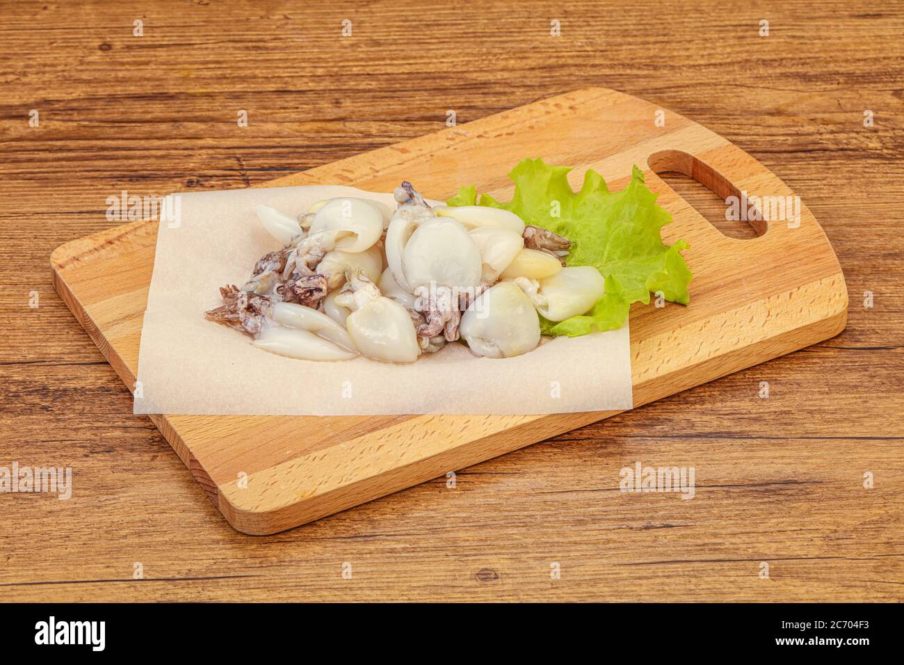 Raw seafood - cuttlefish for cooking over board Stock Photo - Alamy