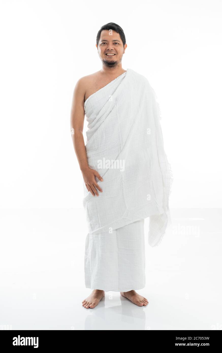 pose muslim asian man standing with tasbih while standing in white ...