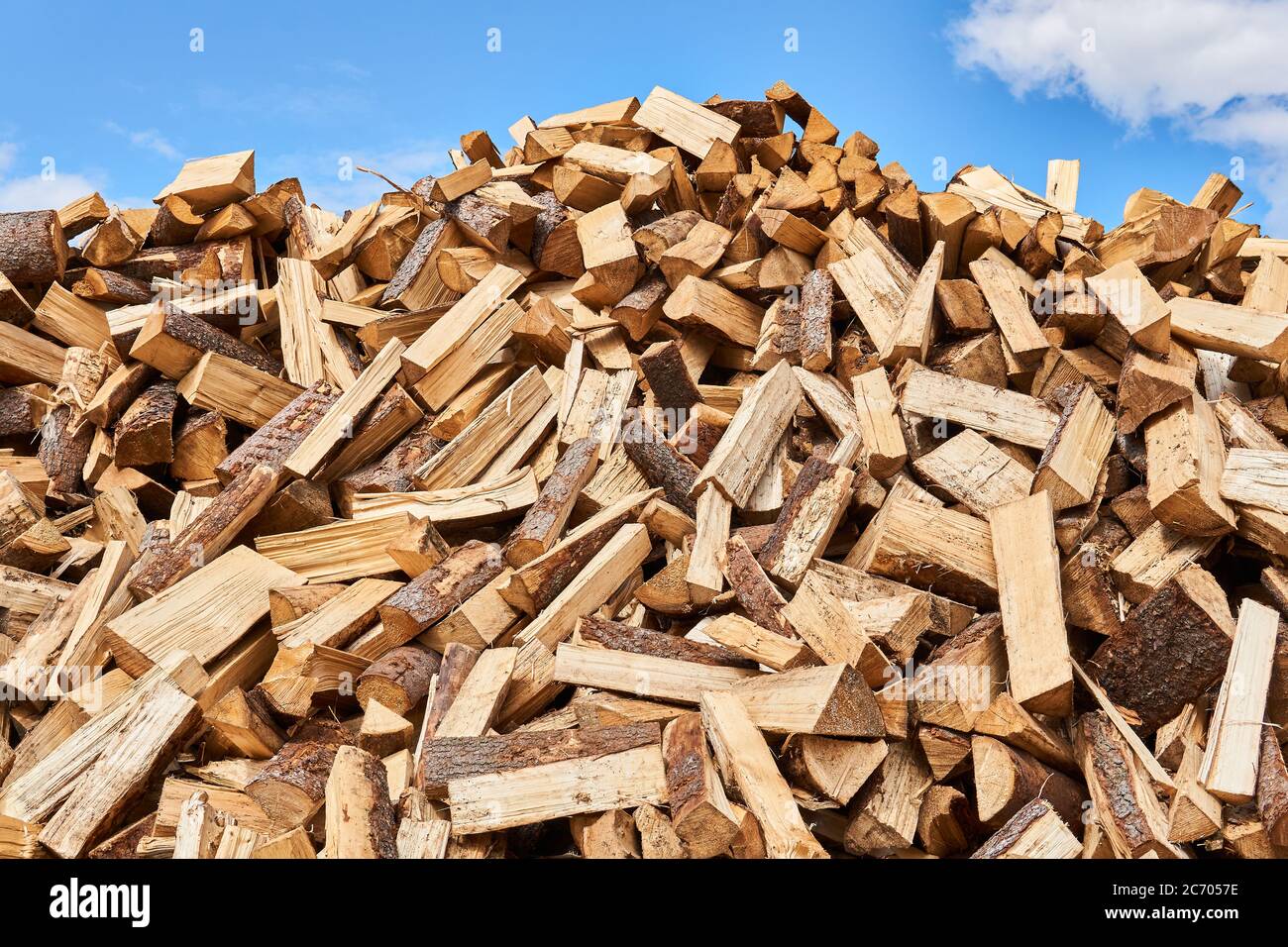 huge pile of firewood chocks against the sky close-up Stock Photo - Alamy