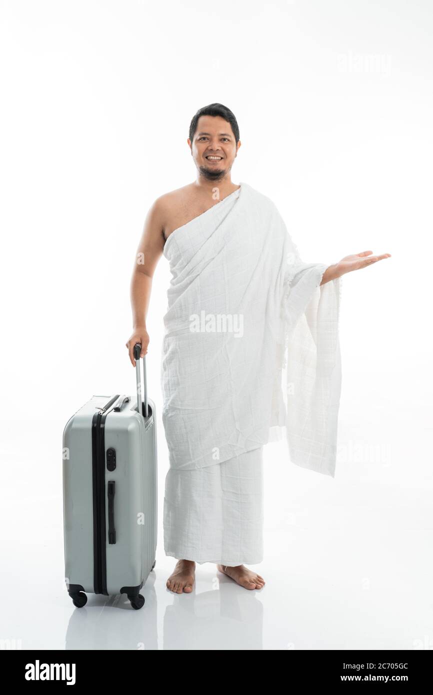 asian male with ihram presenting copyspace. hajj and umrah man concept ...