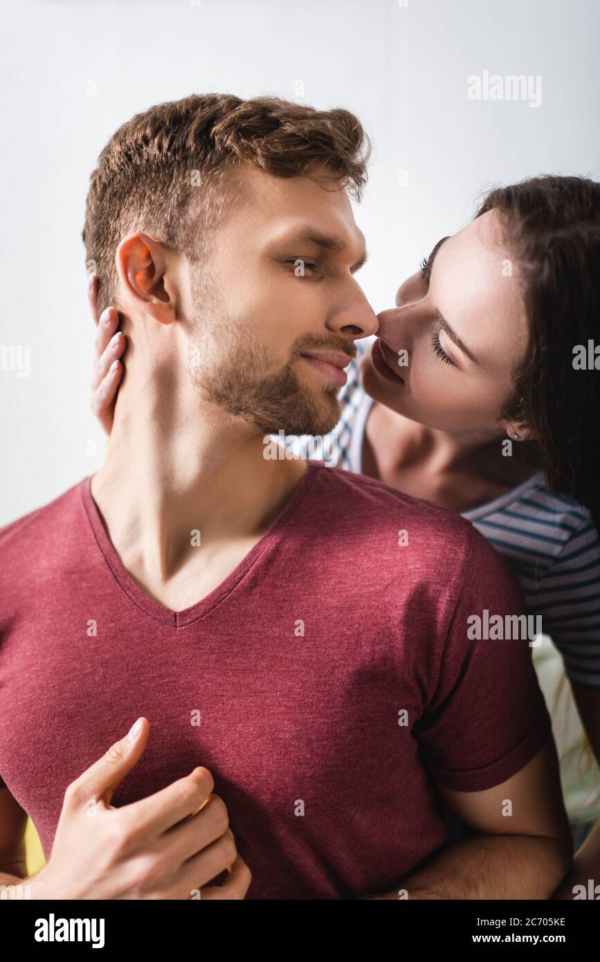 happy young couple hugging and going to kiss at home Stock Photo - Alamy
