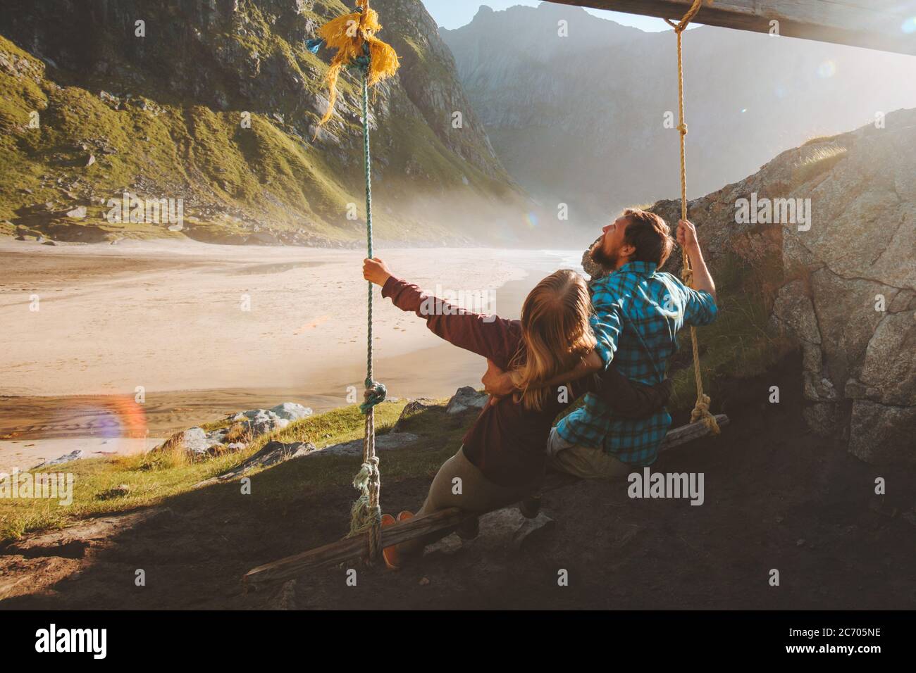 Family on beach on swing hi-res stock photography and images - Alamy