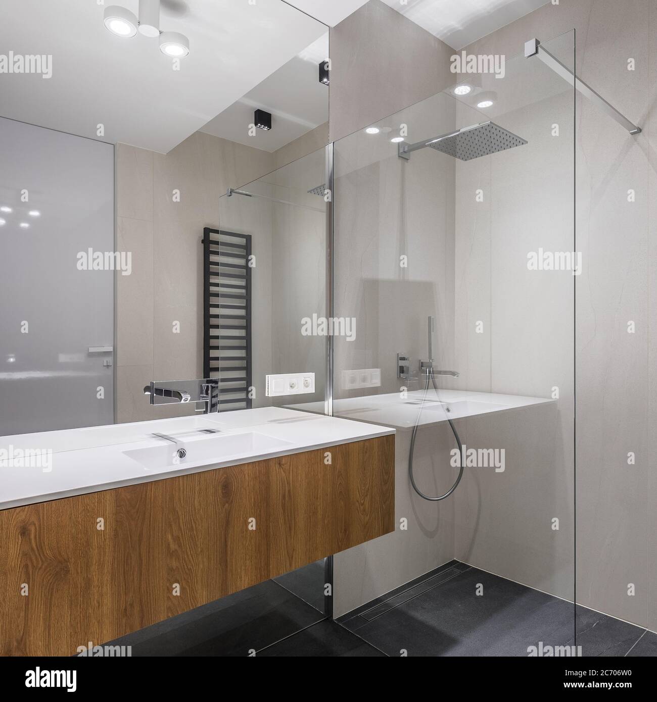 Modern bathroom with wooden basin cabinet and big shower Stock Photo ...