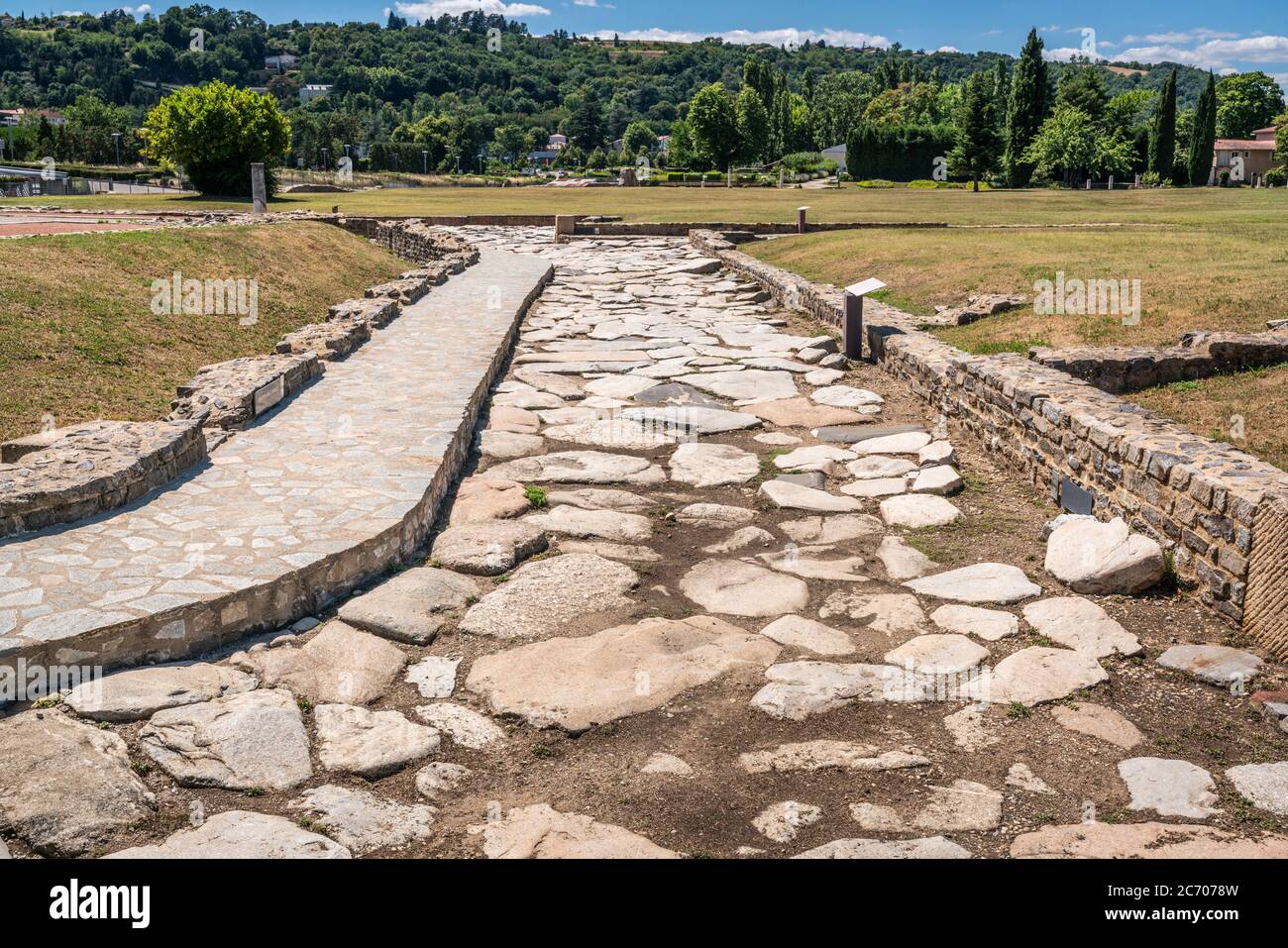 Ruins of an ancient Roman road in the archeological Gallo-Roman site of ...