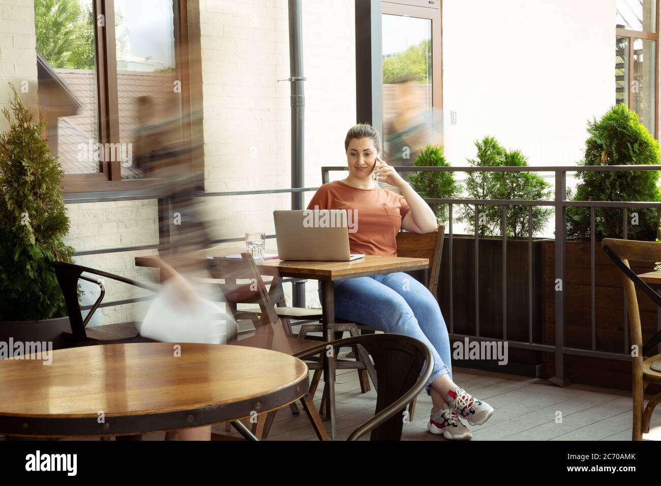 Happy, successful. Caucasian inclusive plus-size model in daily routine ...