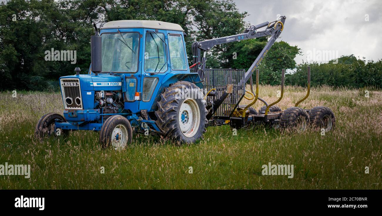 Ford 6600 tractor utility model with Riko trailer and crane Stock Photo ...
