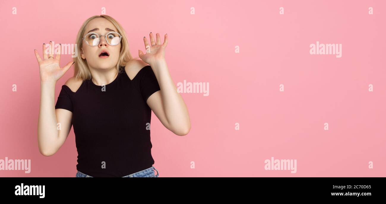 Shocked, wondered. Portrait of young woman with bright emotions on ...
