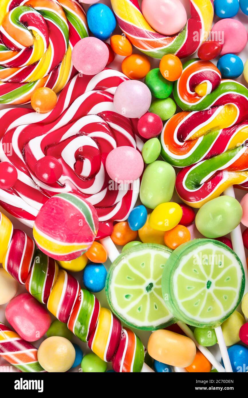 Colorful lollipops and different colored round candy Stock Photo - Alamy