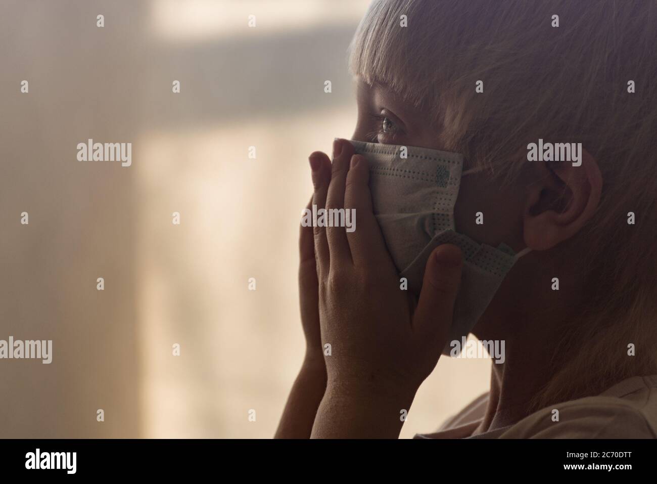 Patient is child in medical mask. Frightened boy in the surgical mask ...