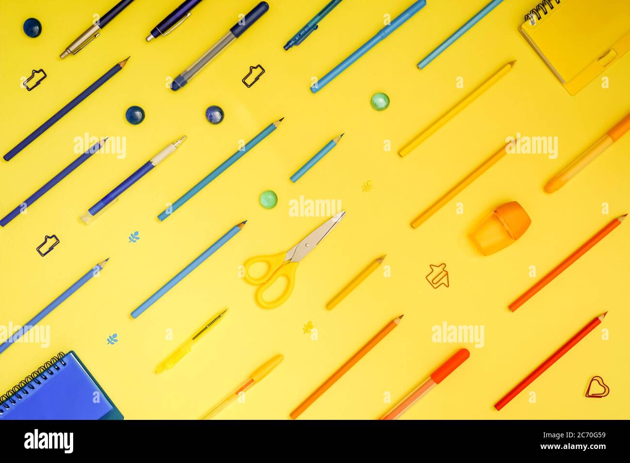 Stationery on yellow. Flat lay. Rows of tools, gradient colors from ...