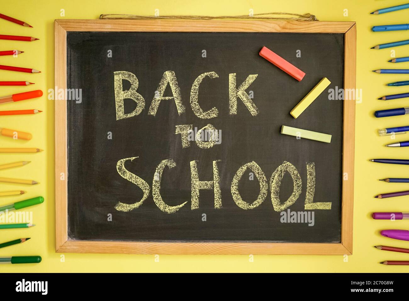 Blackboard and lettering Back to school. Yellow background. School ...