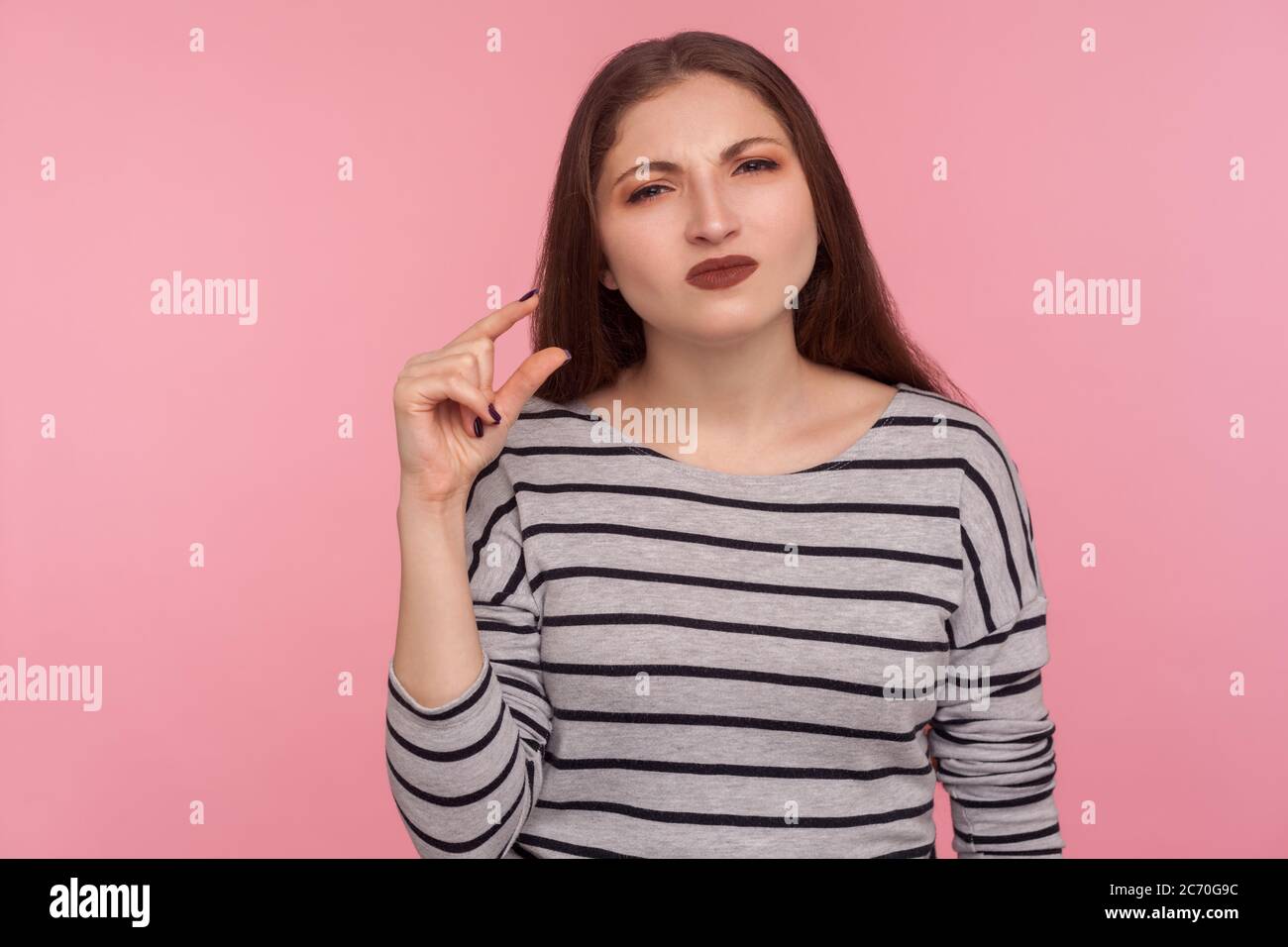 Very small amount! Portrait of woman disappointed with little size ...