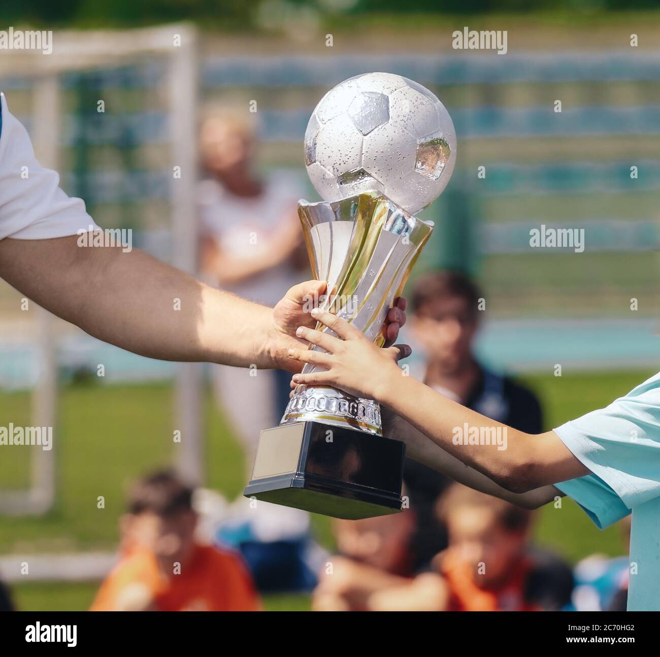 Passing of the Soccer Trophy Moment. Young Player Awarding Trophy ...