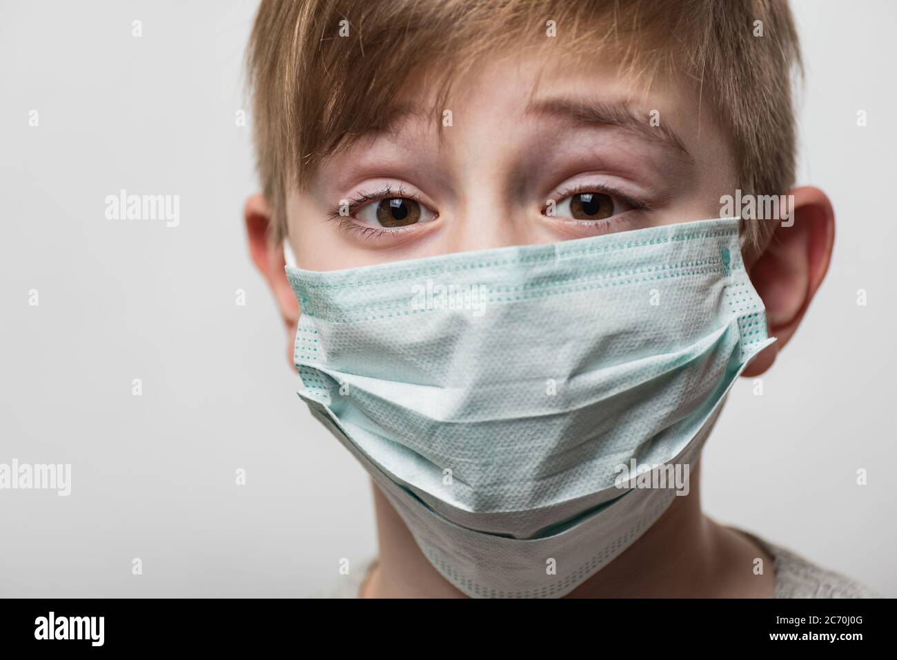 Boy wearing medical mask to protect from viruses. Portrait child close ...