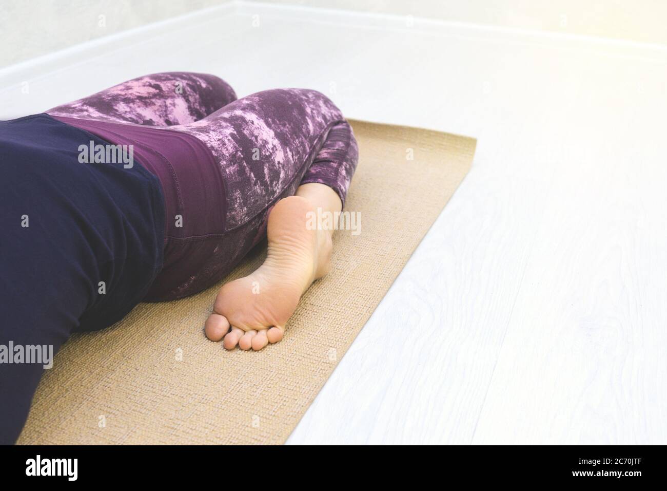 Woman practicing yoga indoor. Horizontal, white background Stock Photo ...