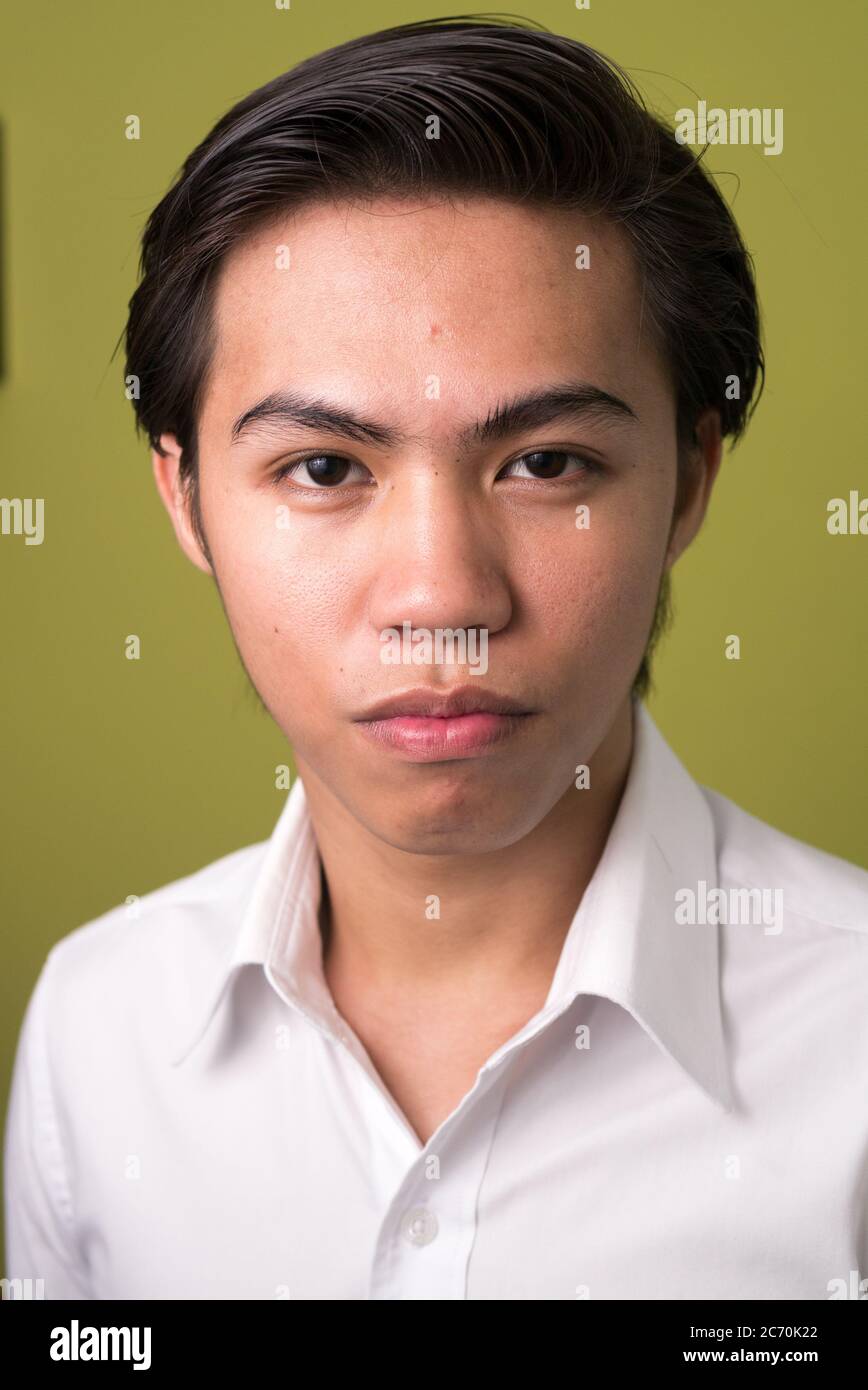 Face of young Filipino businessman looking at camera Stock Photo - Alamy