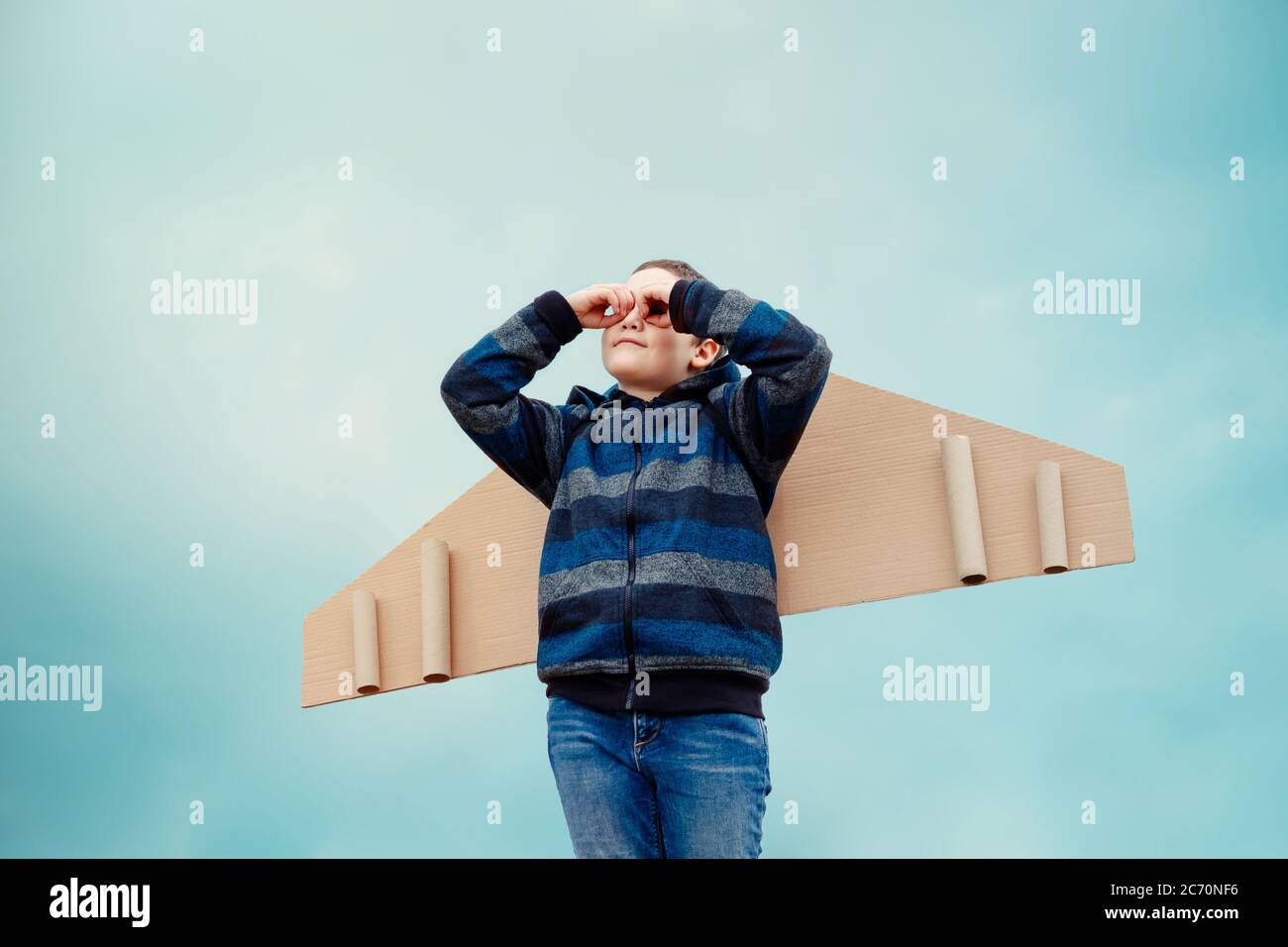 Child pilot looks through improvised binoculars into the distance Stock ...
