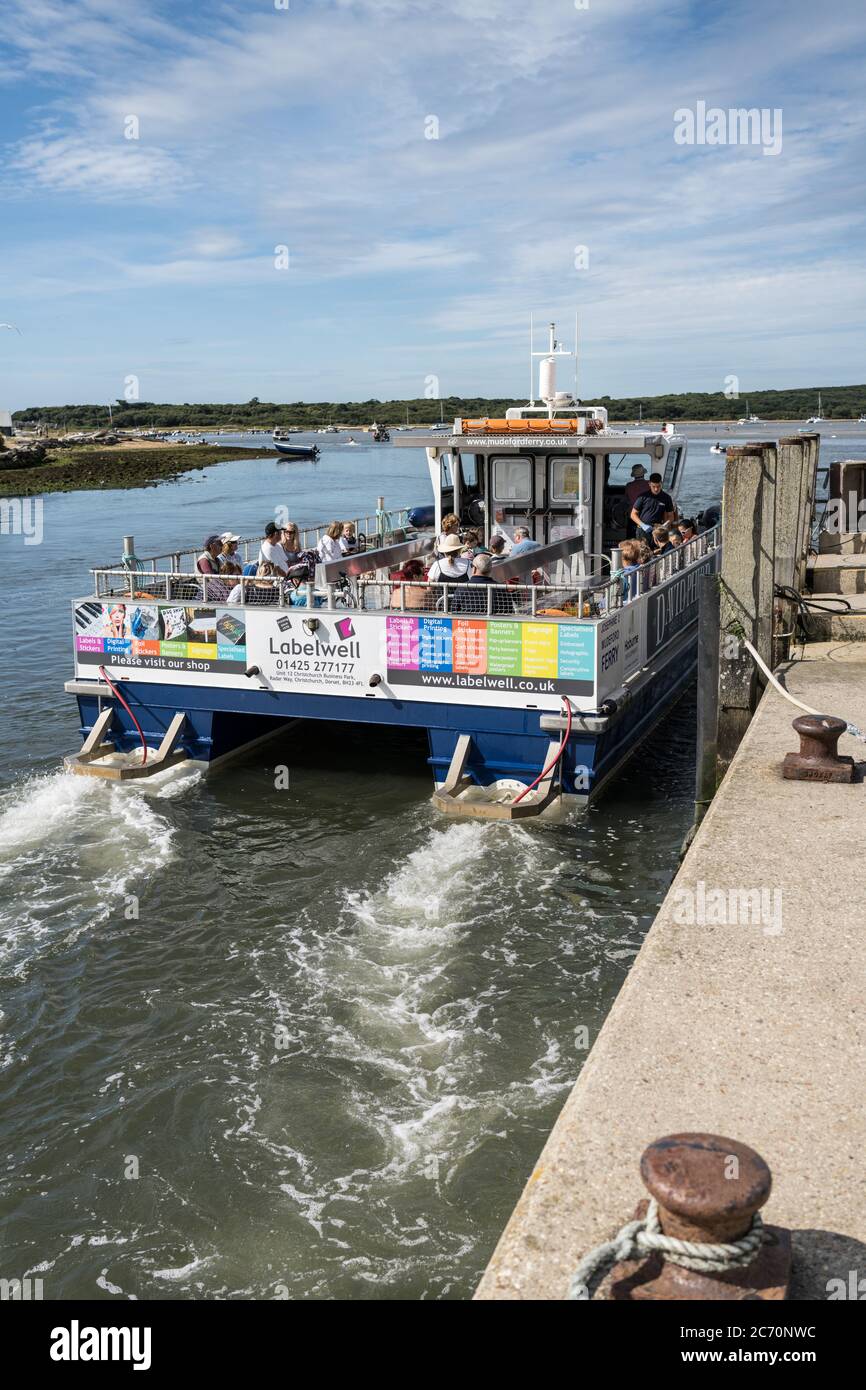 Ferry crossing with people on board to Mudeford sandbank form Mudeford ...
