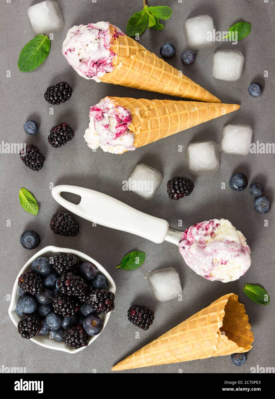 Fruit ice cream with fresh blackberry and blueberry, ice cubes and ...