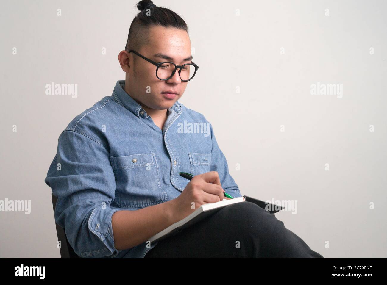 Fat man on chair hi-res stock photography and images - Alamy