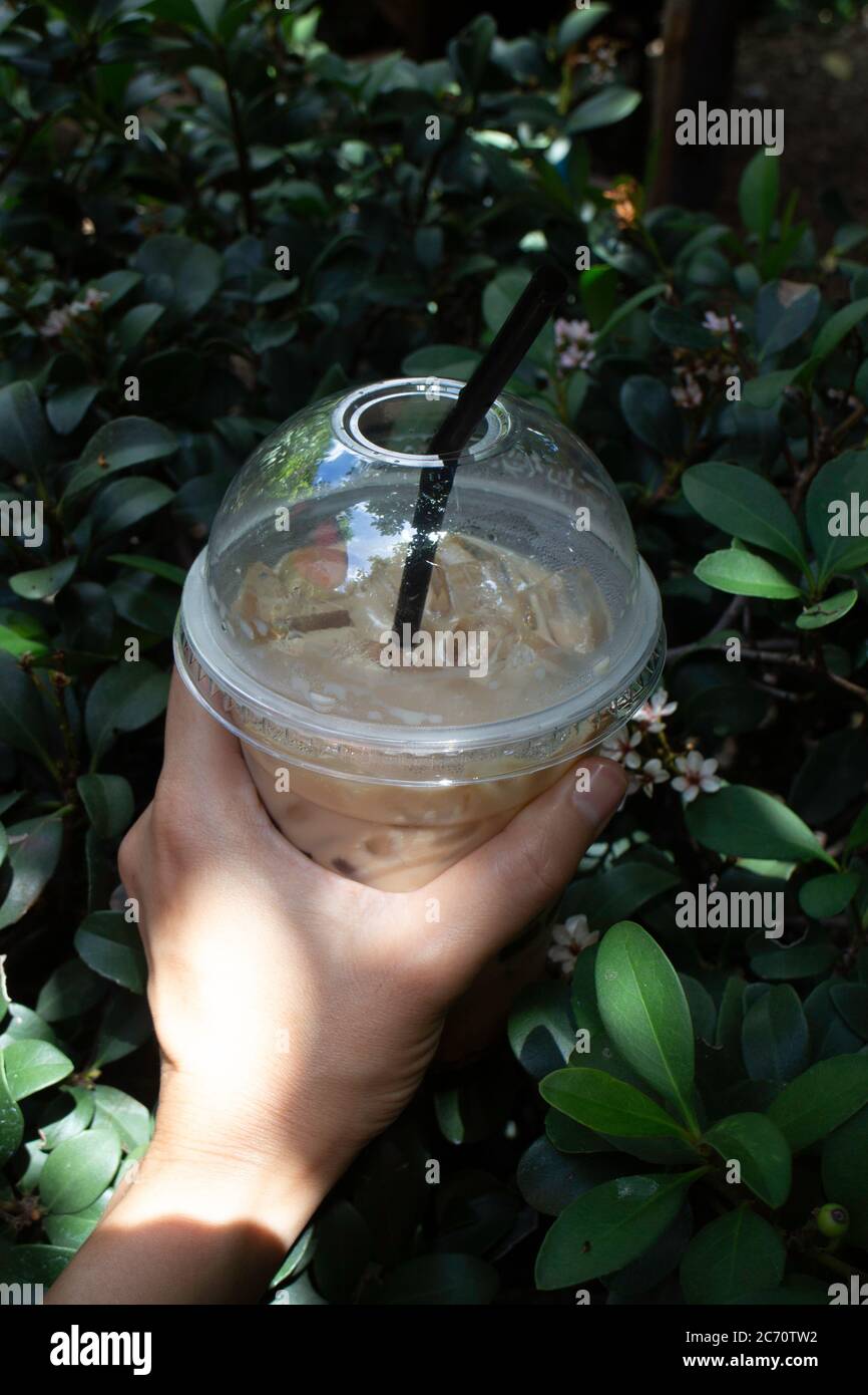 Hand on iced coffee drink, stock photo Stock Photo - Alamy