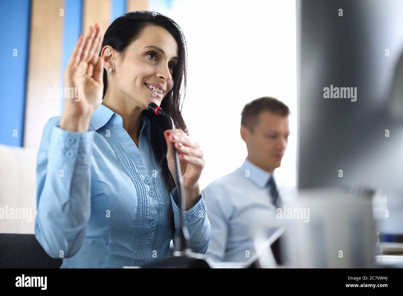 Woman conference microphone gesture hi-res stock photography and images ...
