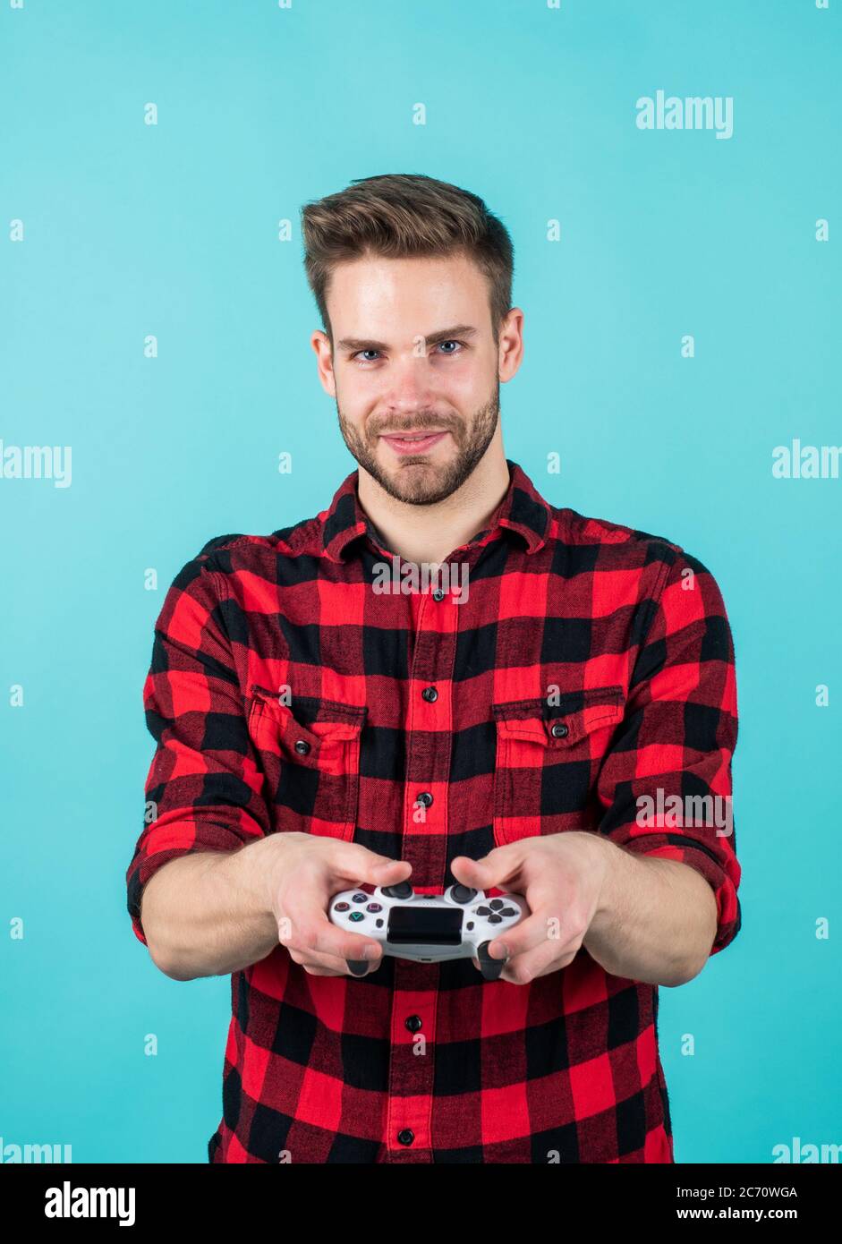 Everything is so real. young man hold game controller to play video ...