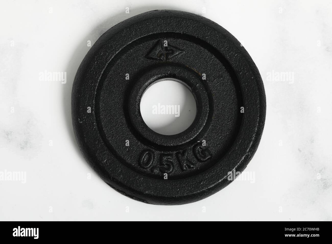 black weight on white background heavy metal 500 grammes Stock Photo ...