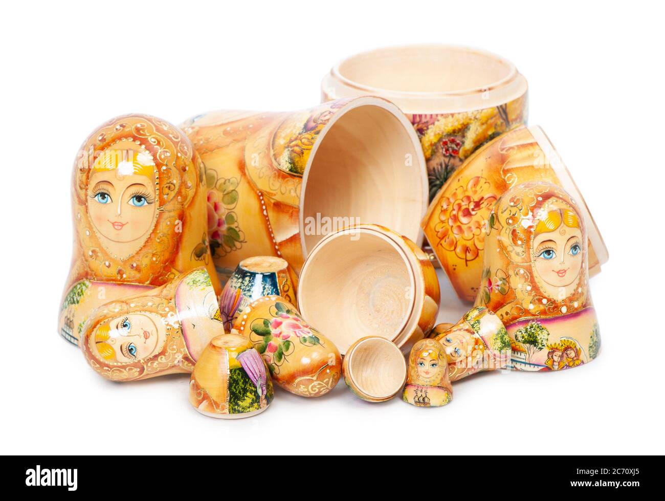 Russian folk wooden nesting doll "matrioshka" isolated over white ...