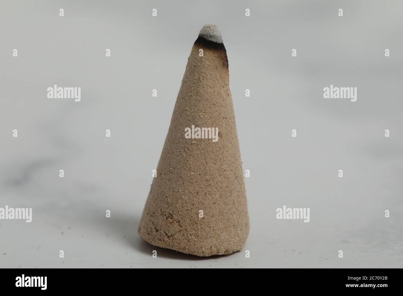 relaxation incense cone on white marble background. Good smell stick ...