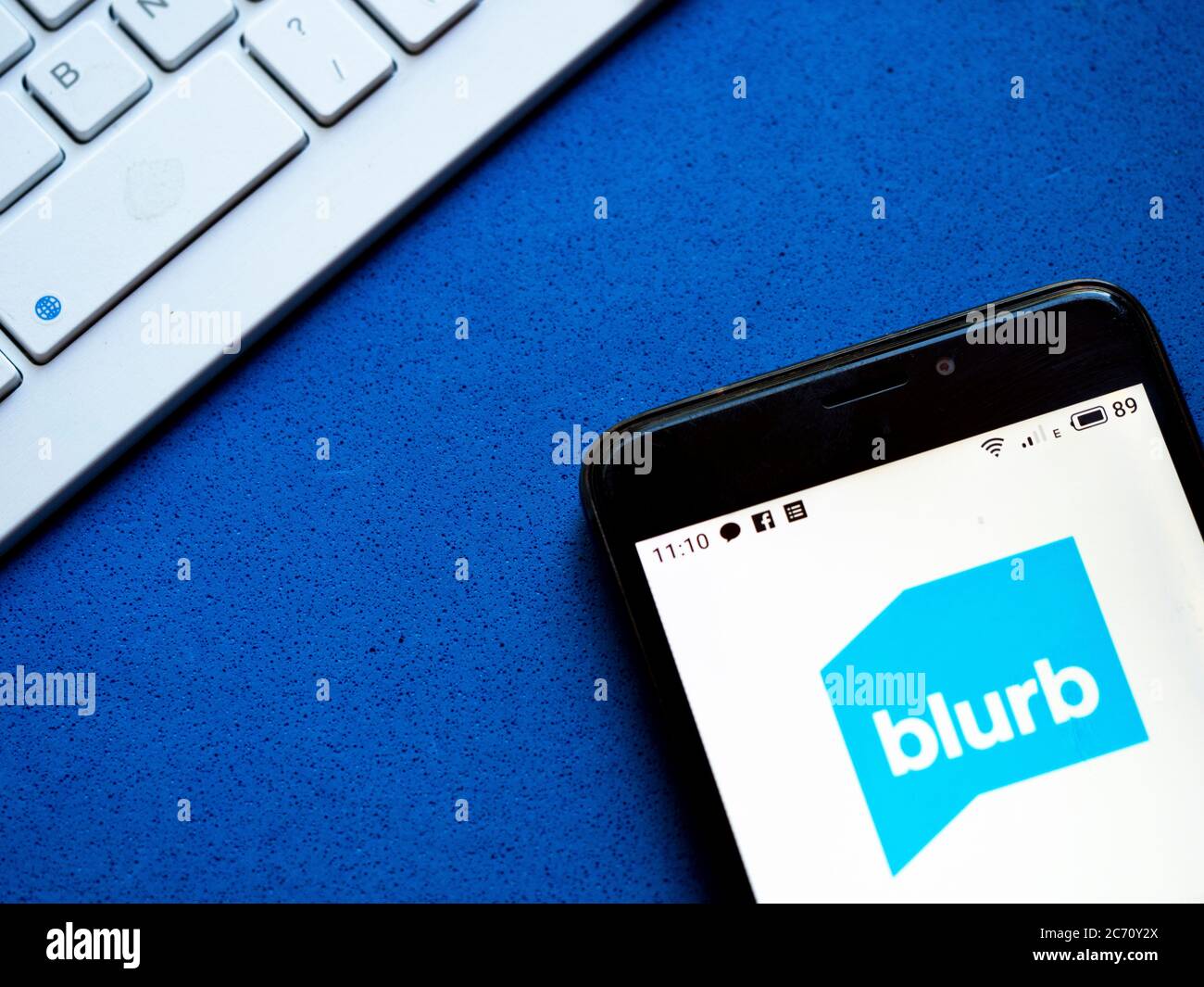 In this photo illustration an e-commerce Blurb logo is seen displayed ...