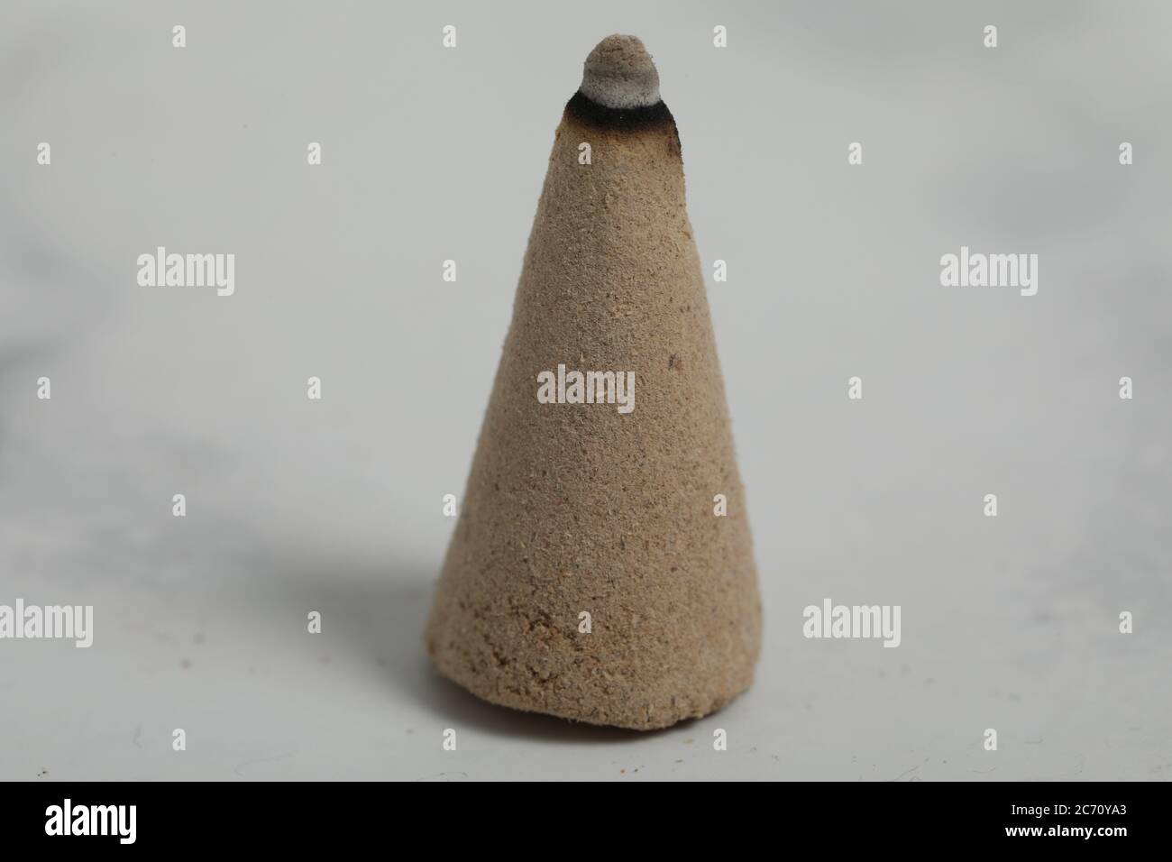 relaxation incense cone on white marble background. Good smell stick ...