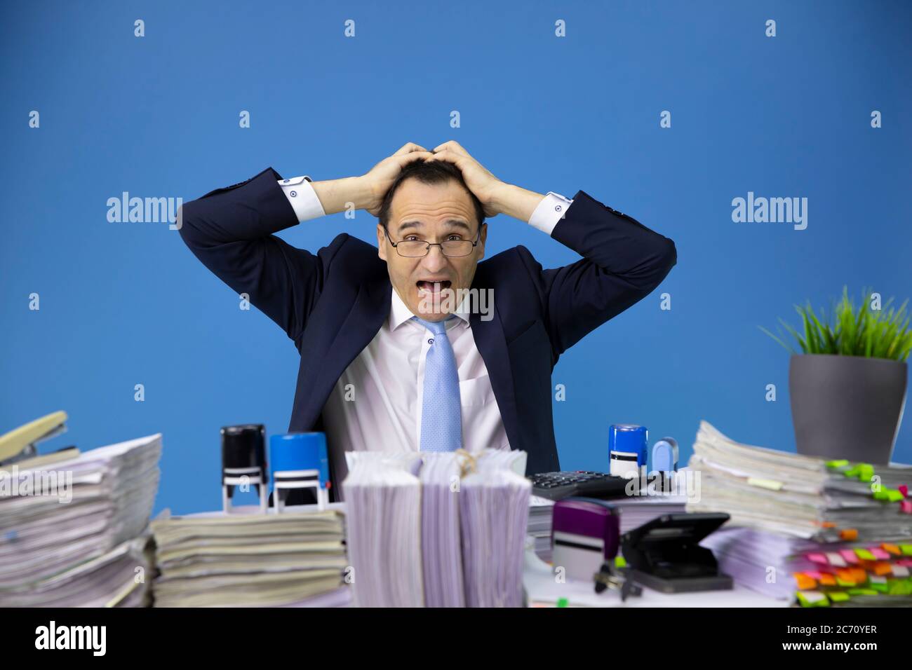 Office manager amazed, screaming and tearing hair on his head Stock ...