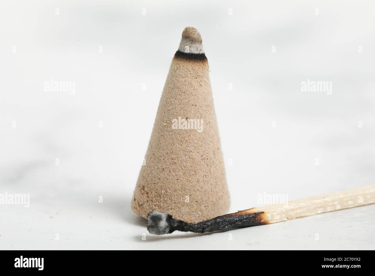 relaxation incense cone on white marble background. Good smell stick ...