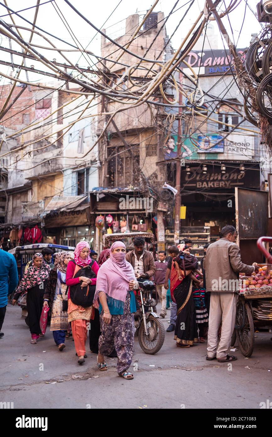 New Delhi / India - February 18, 2020: Muslim people walking down alley ...