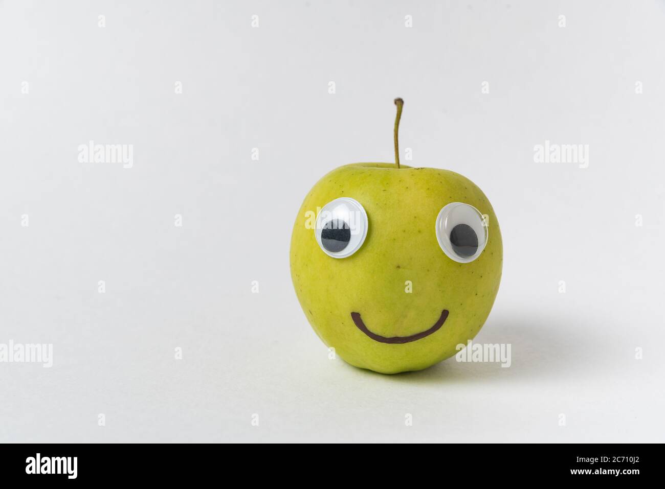 Apple smiley on white background. Apple with Googly eyes and drawn ...