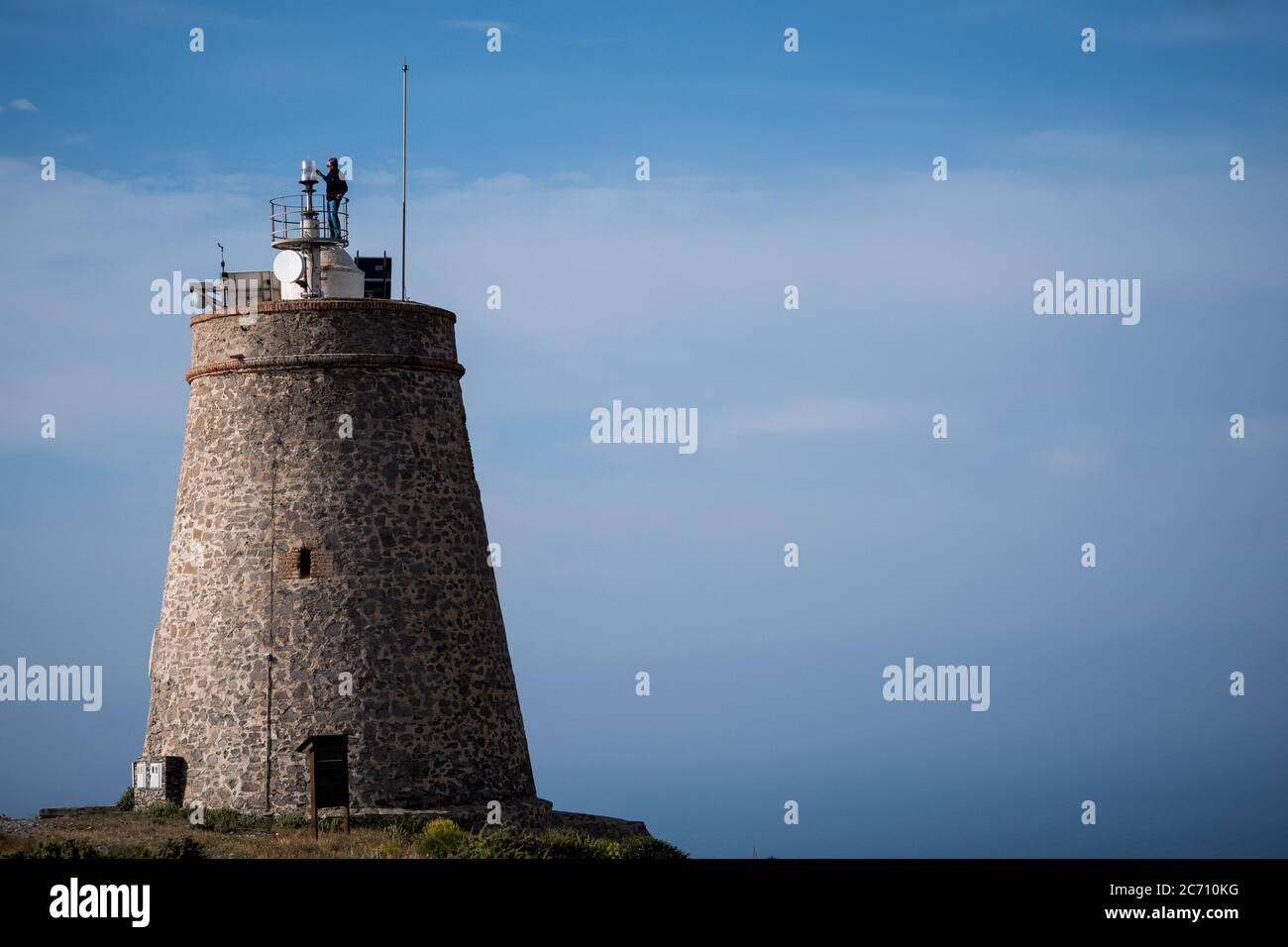 Mario Sanz is cleaning one of the lights from the Torre de los Lobos ...