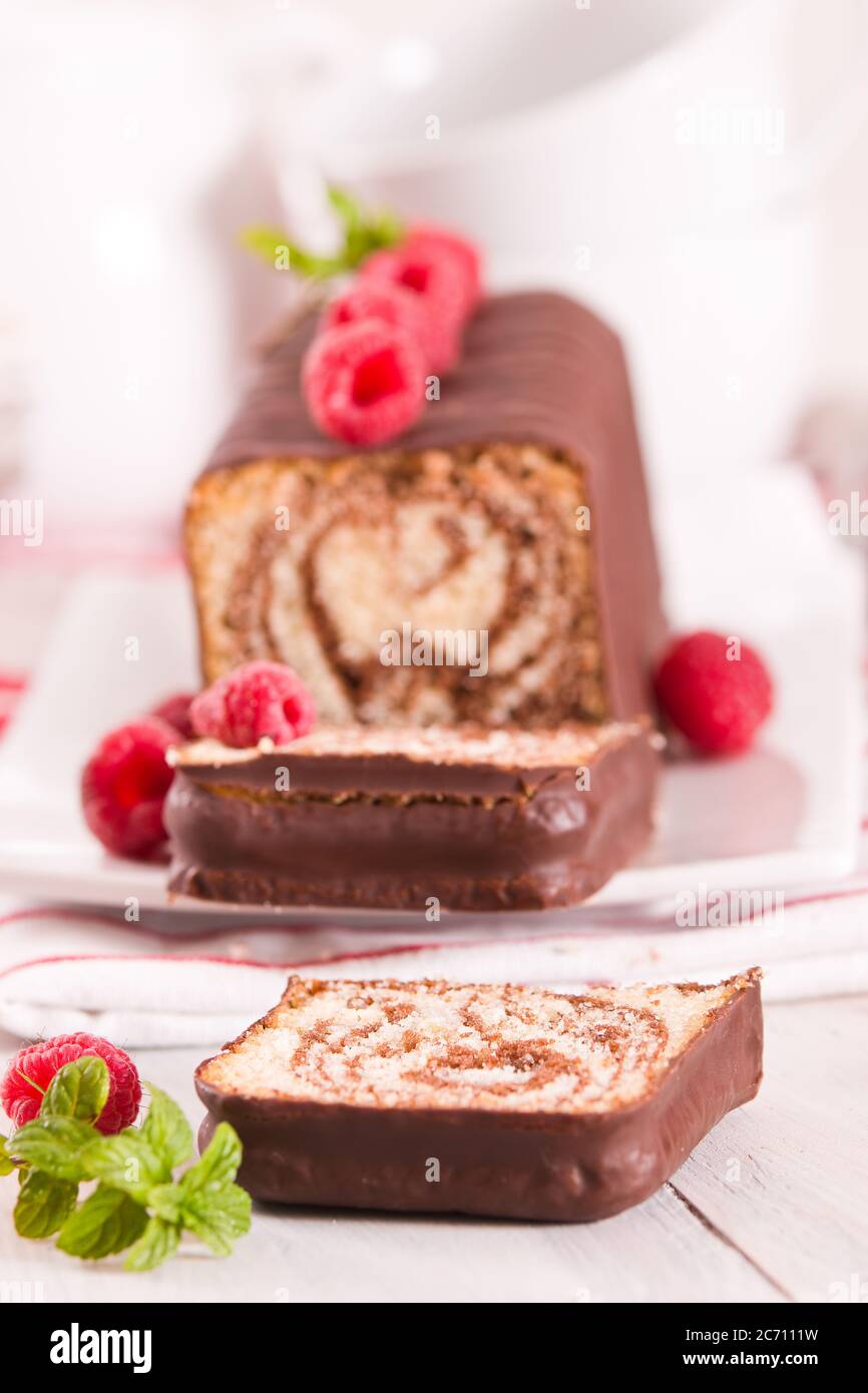 Marble cake with raspberries Stock Photo - Alamy
