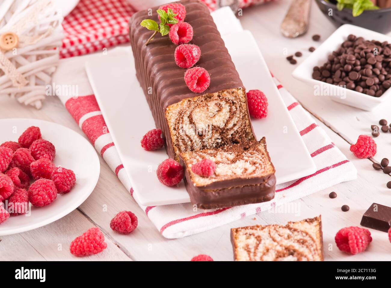 Marble cake with raspberries Stock Photo - Alamy