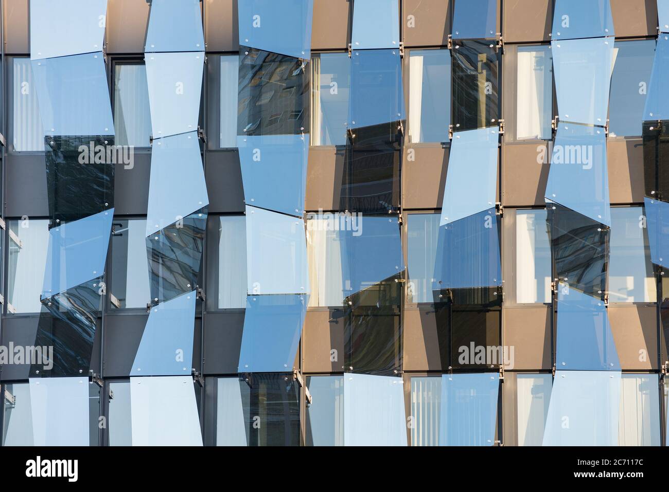 Glass facade buildings of irregular geometry. Modern building in hi ...