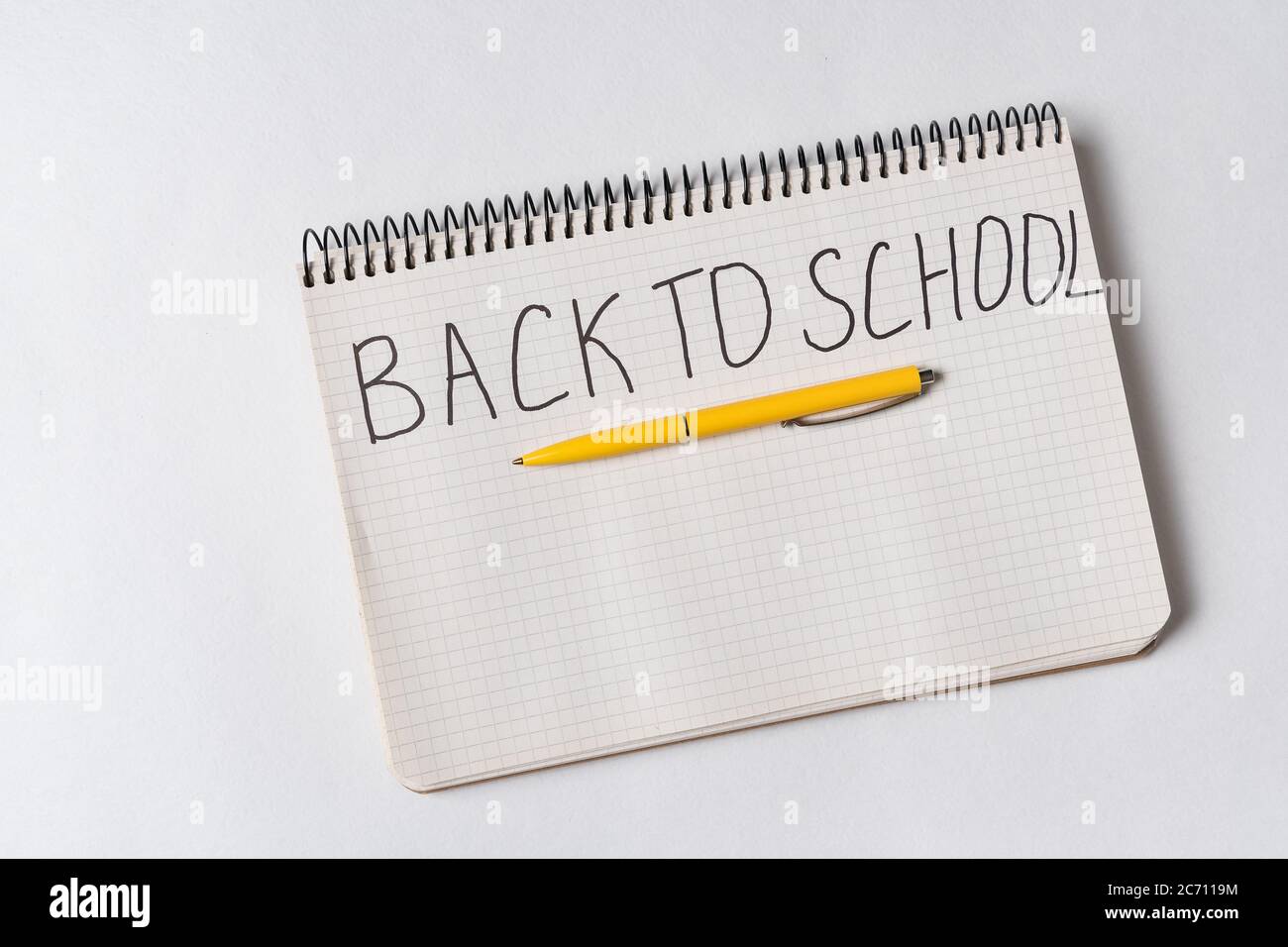 Handwriting notice in notebook BACK TO SCHOOL. White background, top ...