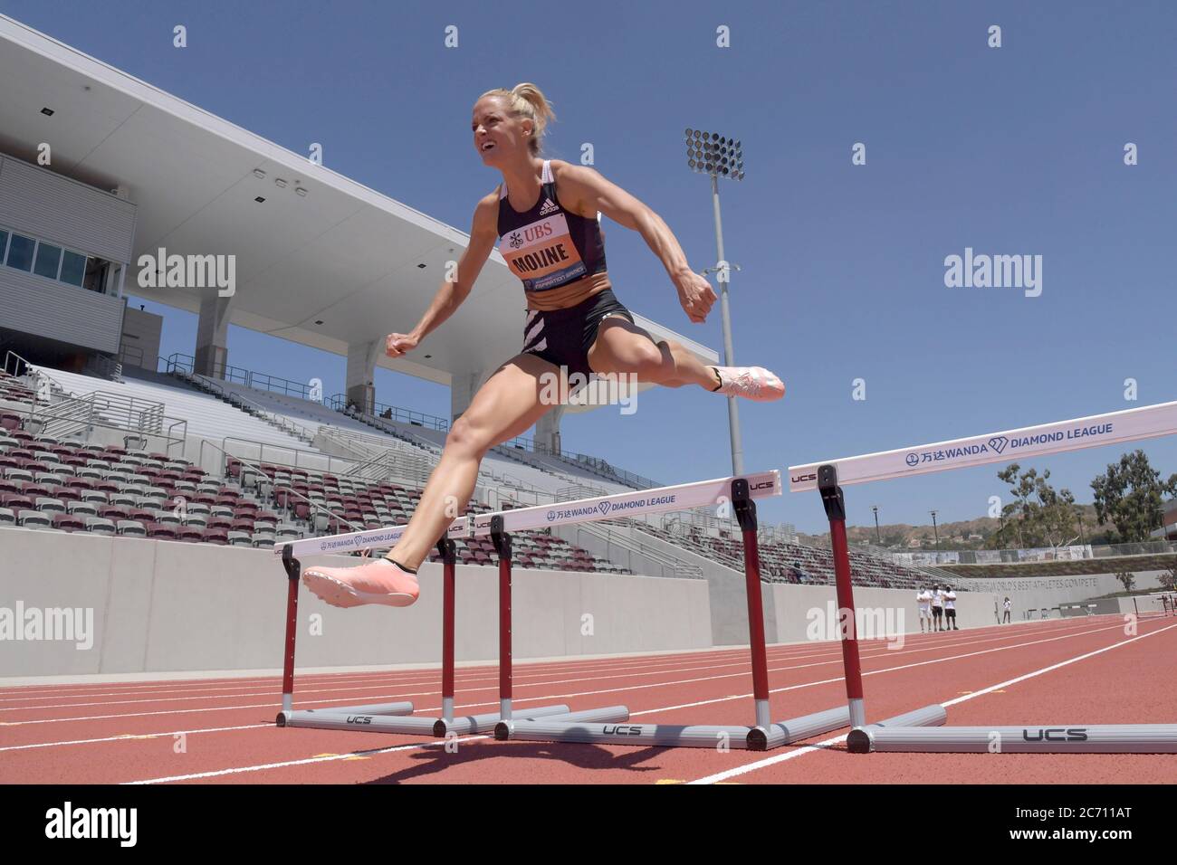 Georganne Moline wins the women's 300m hurdles in 39.08 during the ...