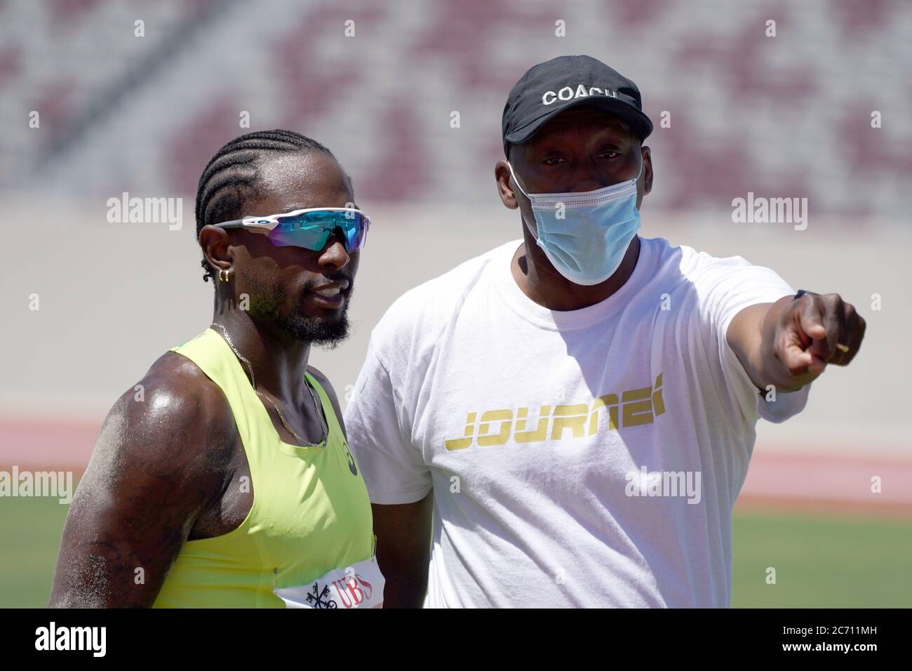 Omar Craddock (left) with coach Al Joyner during the Zurich Weltklasse ...