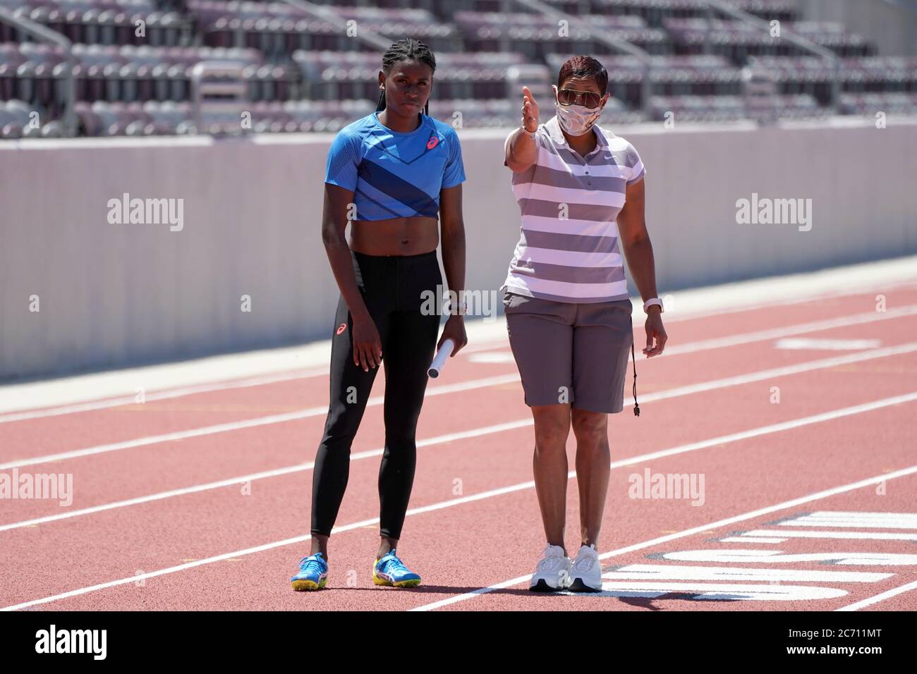 Candace Hill (left) talks with Southern California Trojans coach Caryl ...