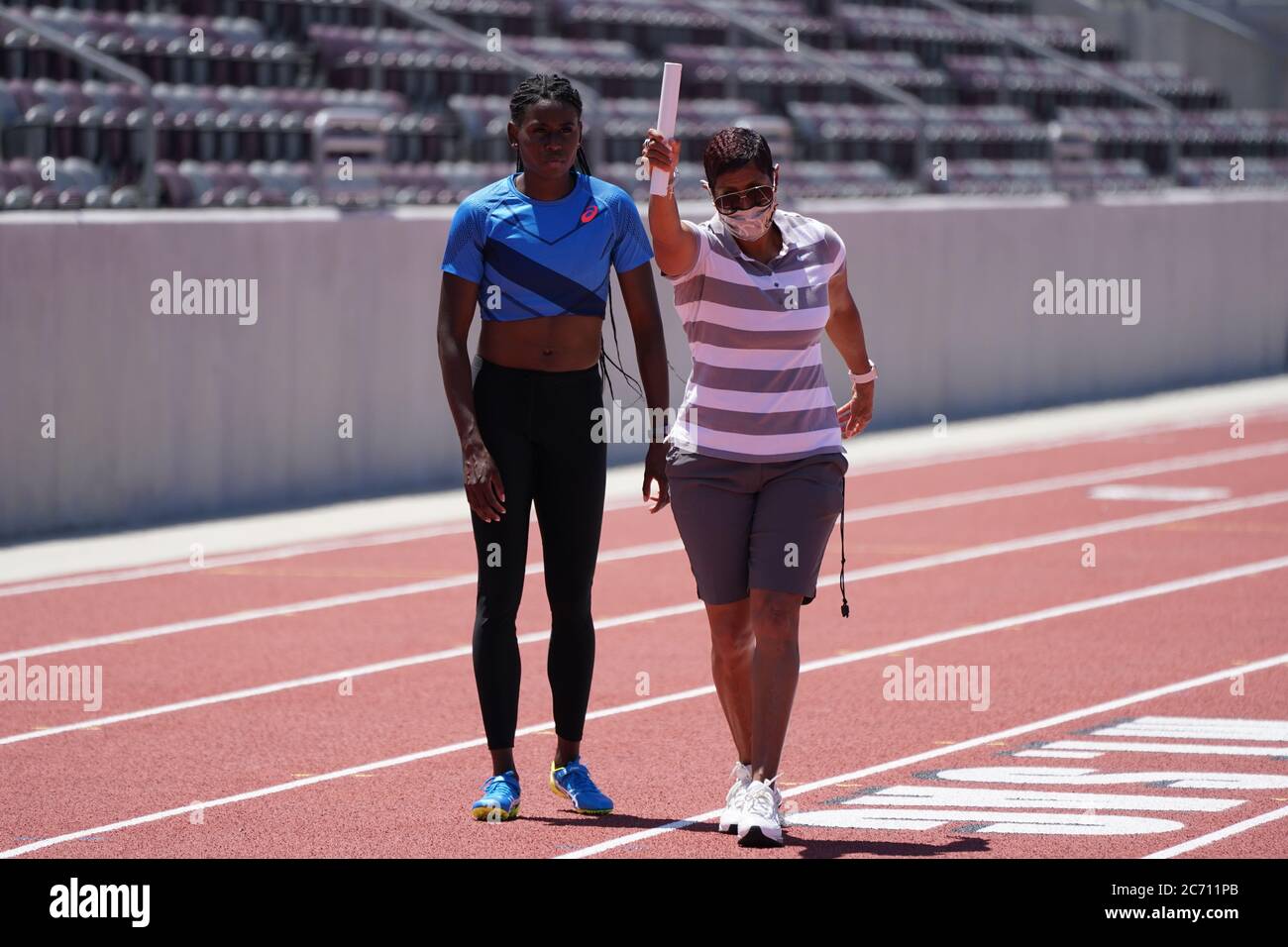 Candace Hill (left) talks with Southern California Trojans coach Caryl ...